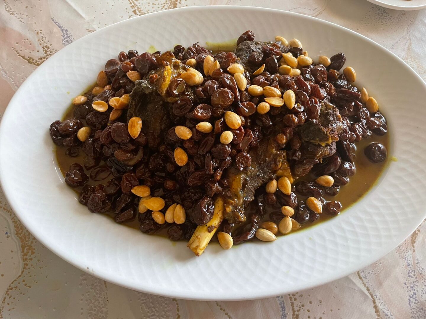 Mrouzia: Moroccan Lamb Confit with Raisins, Almonds, and Honey